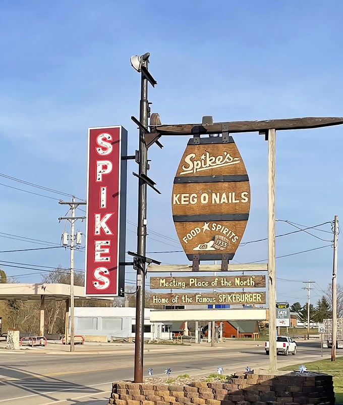 Spike's barrel-shaped sign stands tall against Michigan skies &ndash; a North Woods burger beacon for generations of travelers.