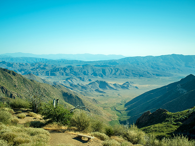 Sunrise Highway lives up to its name. From this overlook, rolling desert valleys and distant peaks stretch endlessly under the morning sky.