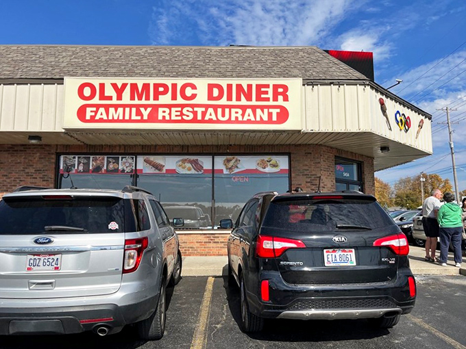 Bold red letters announce a place where breakfast champions are made daily. Gold medal pancakes await!