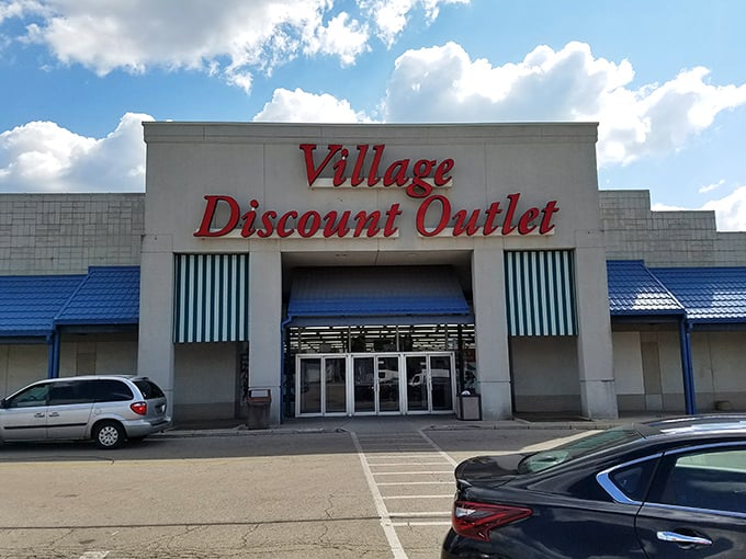 Village Discount Outlet's distinctive red signage and blue awnings make it impossible to miss. Your wallet's happy place!