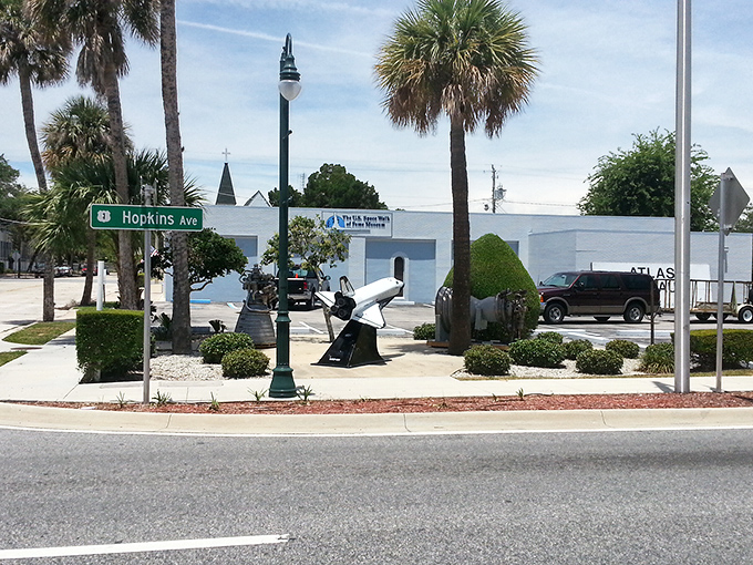 Rain-slicked parking lot leads to a building filled with actual pieces of America's journey to the stars.