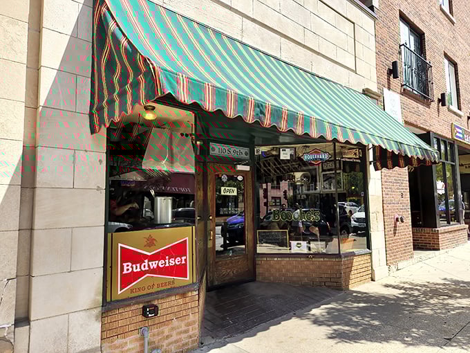 The striped awning and vintage Budweiser sign mark the spot where Columbia's burger tradition has thrived for generations.
