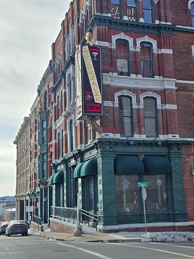 The vertical Boudreaux's sign stands as a downtown landmark, guiding hungry folks to seafood salvation since day one.