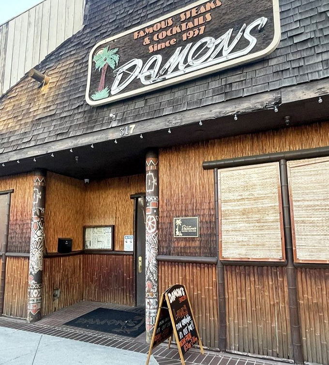 Damon's distinctive facade hints at the tropical-themed steakhouse adventure waiting inside - where great beef meets island-inspired atmosphere.