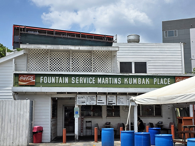That vintage "Fountain Service" sign isn't just nostalgic decoration &ndash; it's a portal to Austin's burger history.