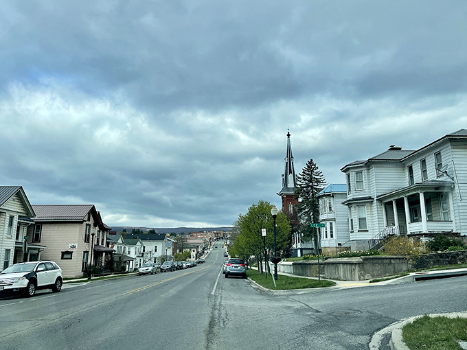 Clouds gather dramatically over Frostburg's affordable neighborhoods, where mountain living comes without the resort town price tag.