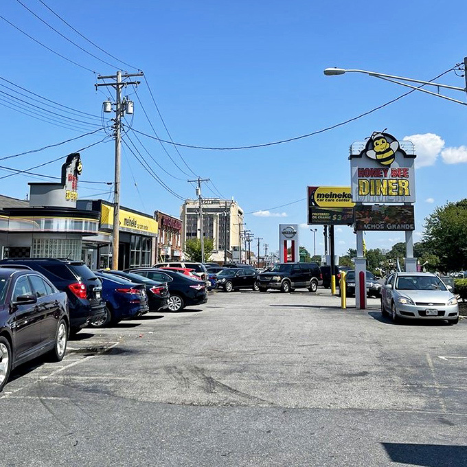 Honey Bee Diner (parking lot view): "A hive of breakfast activity where the honey of hospitality flows freely and the coffee is always buzzing with flavor." 