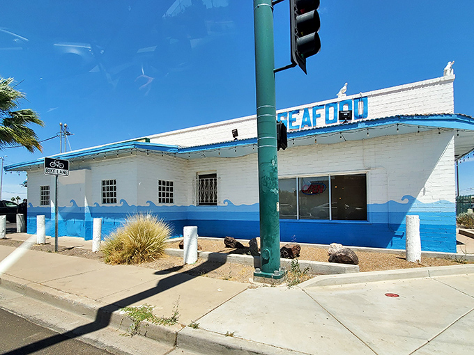 The classic seafood shack vibes of Knock Kneed Lobster are unmistakable. That blue-trimmed building houses some of Phoenix's most beloved fried treasures.