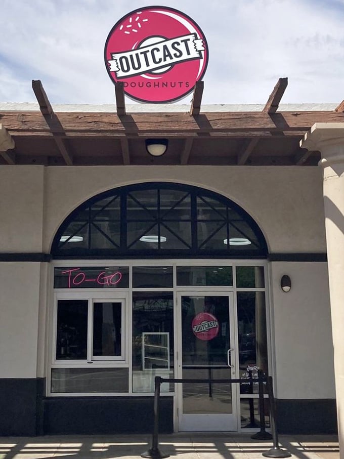 "TO-GO" glows in neon at Outcast Doughnuts, but trust me, you'll want to savor these rebel treats before leaving the parking lot.