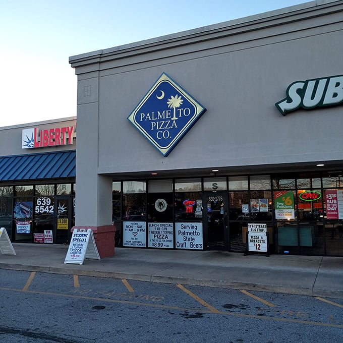 The blue diamond sign with palmetto tree and crescent moon promises pizza with Carolina character.