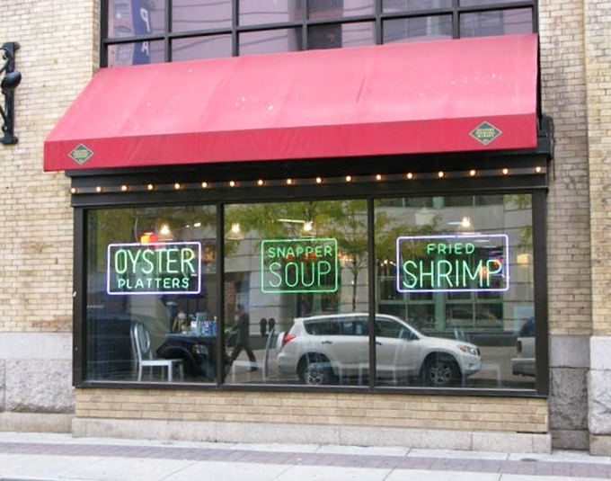 Pearl's Oyster Bar (window display): "Those neon signs aren't lying&mdash;the oyster platters and snapper soup inside are worth stopping for!"