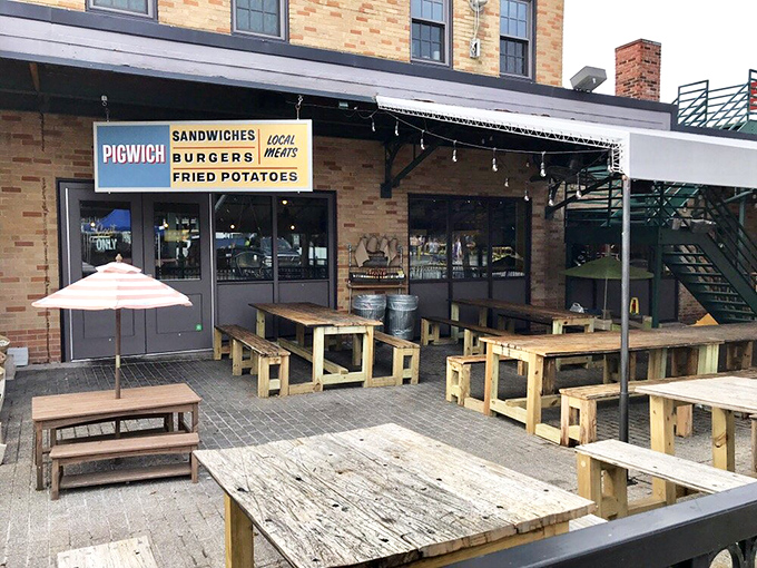 Rustic wooden tables under an open sky &ndash; Pigwich knows the best setting for enjoying their locally-sourced sandwich creations.