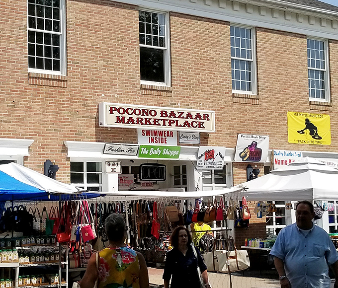 Historic brick meets bargain hunting brilliance! That floral shirt in the foreground is exactly the kind of unexpected fashion find that makes these markets magical.