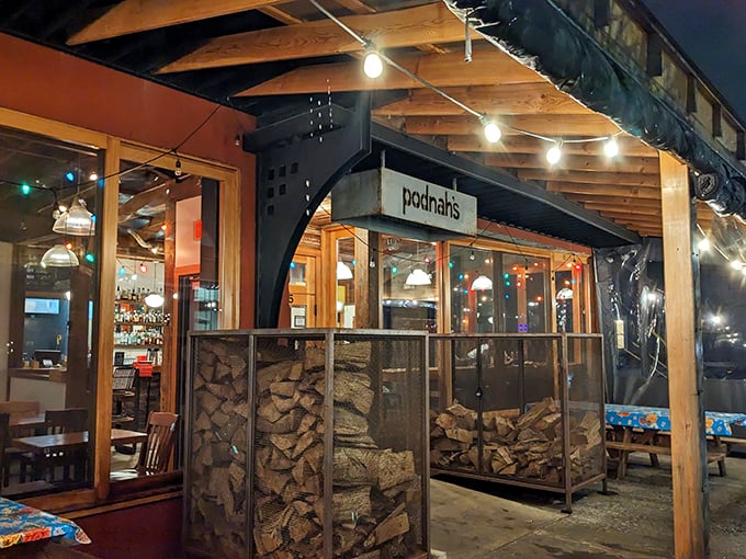Evening at Podnah's, where string lights create the ambiance and wood-fired pits create the magic. Dinner and a show!