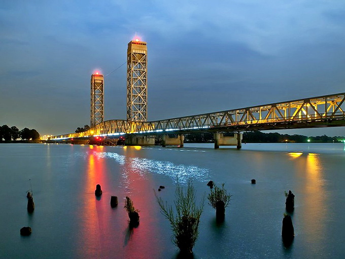 Rio Vista's iconic bridge spans the Sacramento River, its lights reflecting like jewels on the water at dusk.