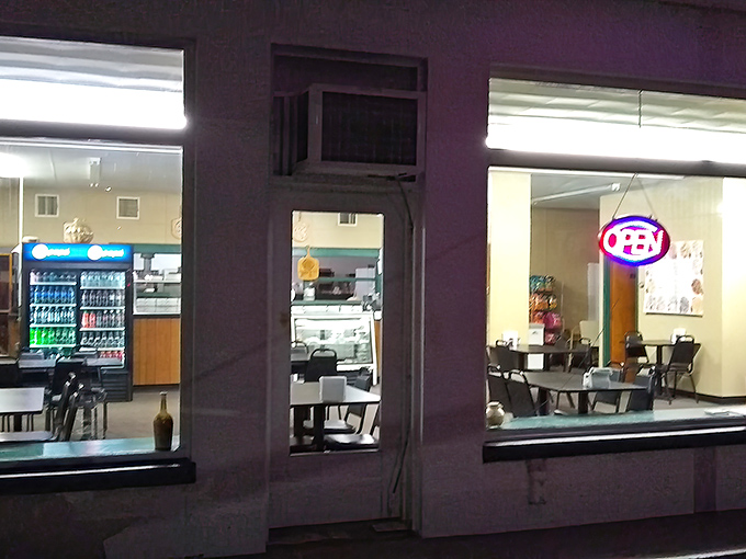 A glimpse through Scicchitano's windows reveals the no-frills approach that lets their legendary pizza shine.