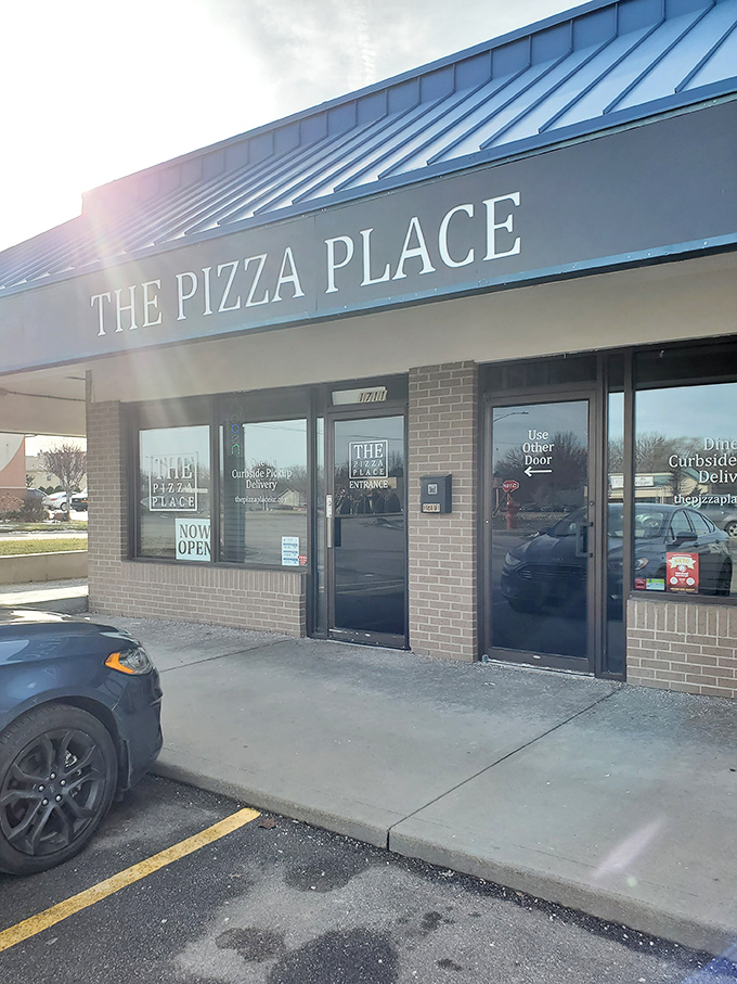 Morning light catches THE Pizza Place's blue awning, beckoning hungry Missourians to start their day with something better than cereal.