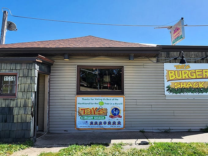 The simple sign announces Tay's neighborhood pride. Behind that humble exterior lurks a burger experience worth bragging about to out-of-town friends.