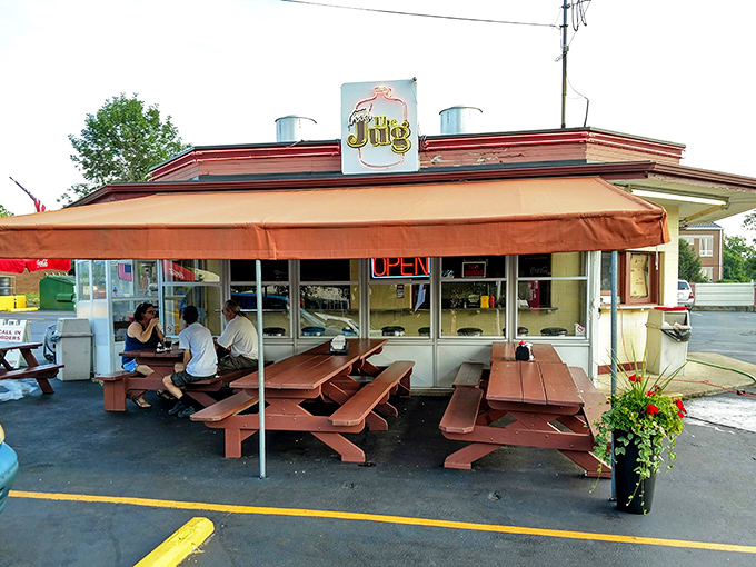 Those picnic tables under The Jug's awning have hosted more meaningful conversations than most therapists' offices.
