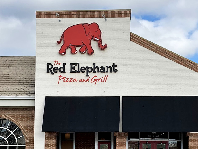 The Red Elephant: Brick building, welcoming windows, and a mascot that never forgets how to make great pizza.