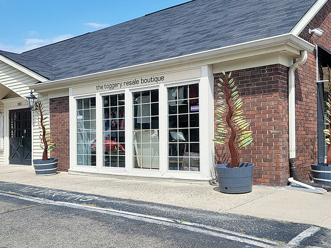 Elegant windows and artistic planters give The Toggery Resale Boutique a touch of class. Secondhand shopping with first-class style.