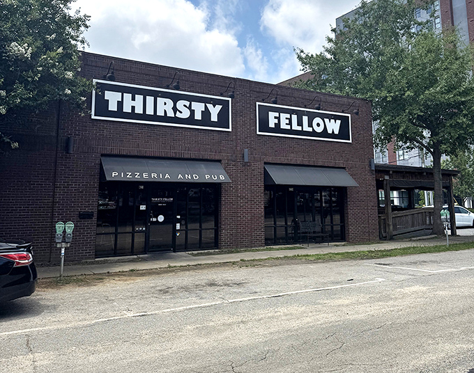 Thirsty Fellow's simple black and white signage gives no hint of the pizza masterpieces waiting just beyond those doors.