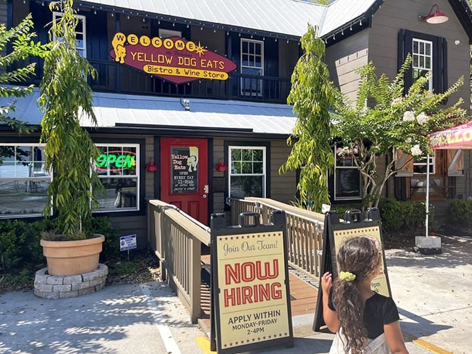 The inviting entrance to Yellow Dog Eats promises a unique experience. "Now Hiring" &ndash; they might need help handling all those hungry customers!