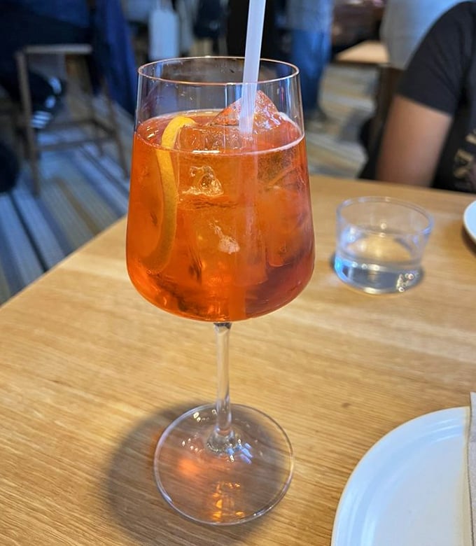 An Aperol Spritz that glows like a California sunset. The Italian aperitivo tradition alive and well on Valencia Street.