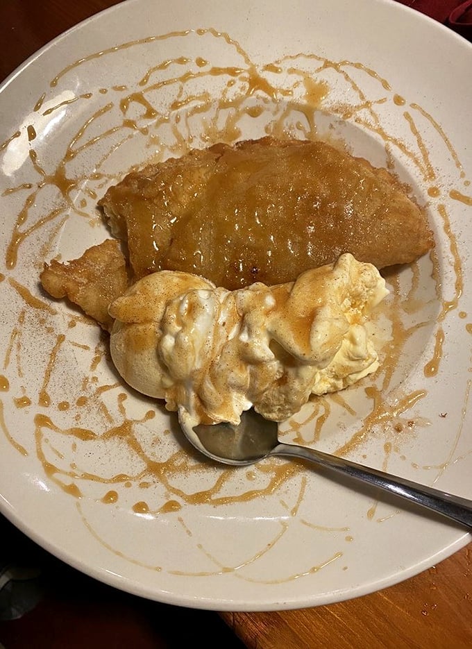 This isn't just dessert; it's an apple fritter with ice cream performing a hot-cold duet that deserves a standing ovation.