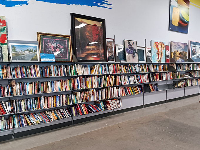 Literary treasures and wall art create an intellectual browsing experience for cultured treasure hunters.