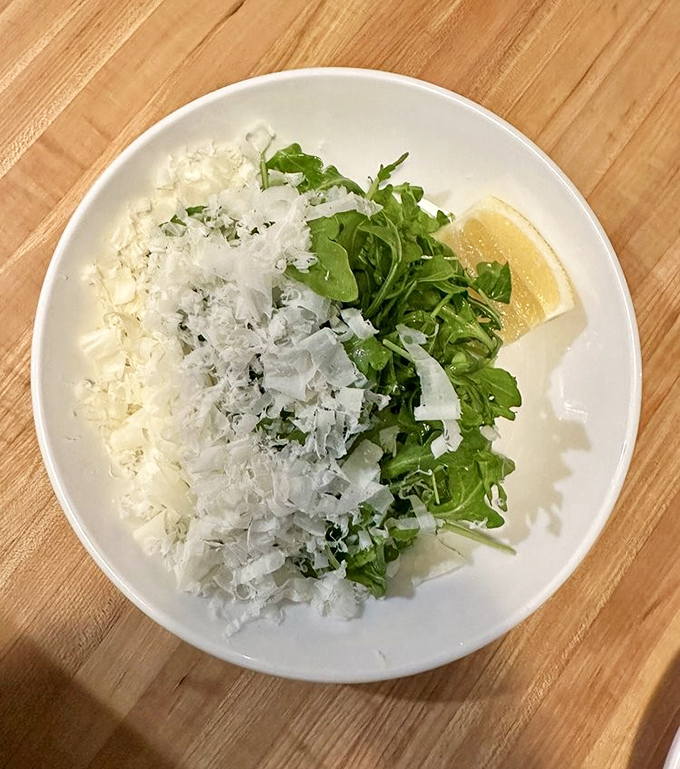 Arugula and parmesan dance together on this plate, with a squeeze of lemon playing matchmaker in this classic Italian romance.