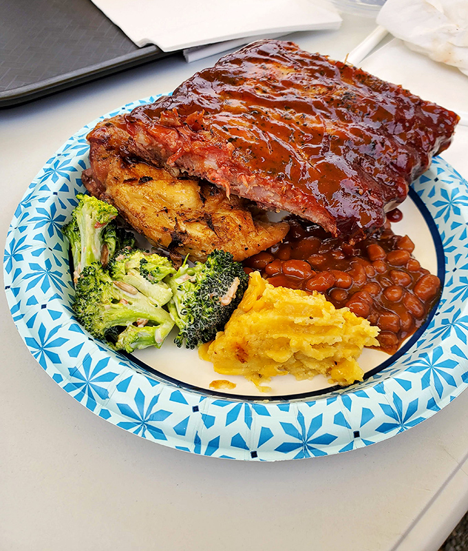 Ribs glazed with sauce so shiny you could check your reflection in them. The kind that make you temporarily forget table manners exist.