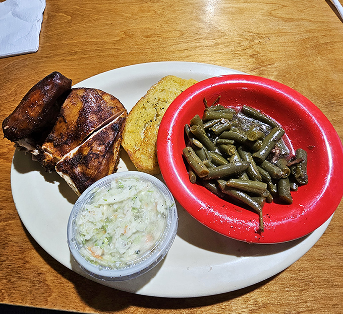 Southern hospitality on a plate: smoky chicken, creamy slaw, and green beans cooked the way your grandmother would approve of.