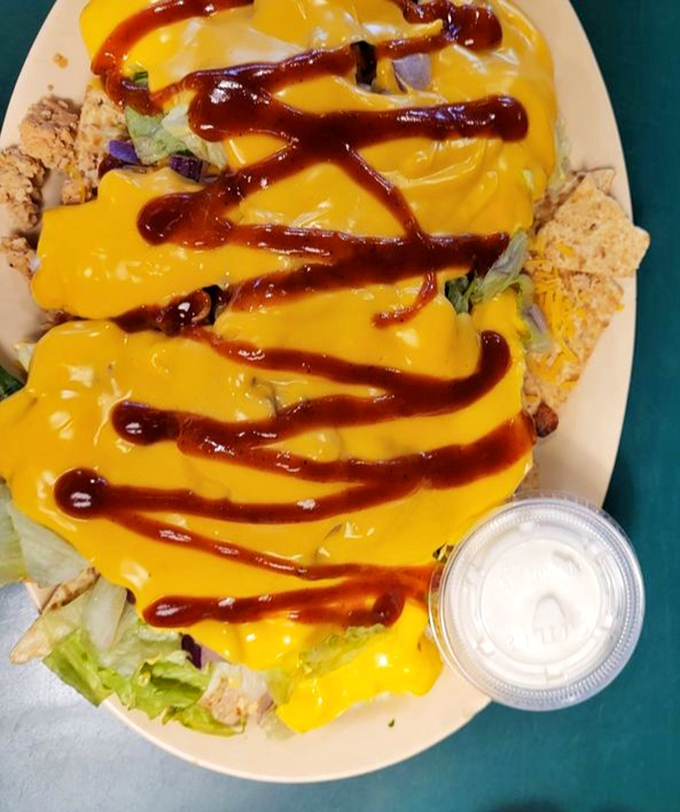 BBQ nachos that throw subtlety out the window. That cheese sauce and barbecue sauce zigzag isn't just for looks&mdash;it's a roadmap to flavor town.