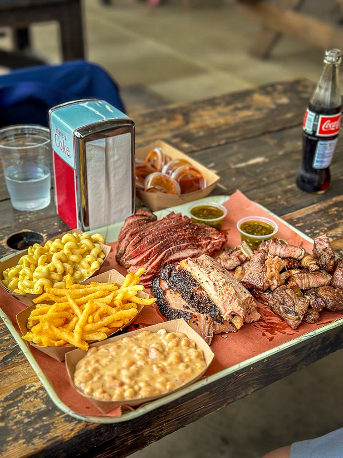 A BBQ platter that makes vegetarians question their life choices. That mac and cheese isn't a side&mdash;it's a co-star in this meaty blockbuster.