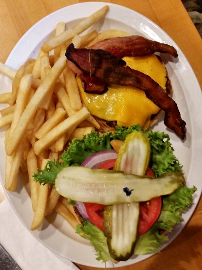 A bacon cheeseburger that doesn't need fancy aioli or brioche buns to prove its worth &ndash; just honest roadside deliciousness.