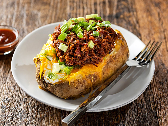 This loaded spud is basically a edible bowl of happiness topped with barbecue magnificence.