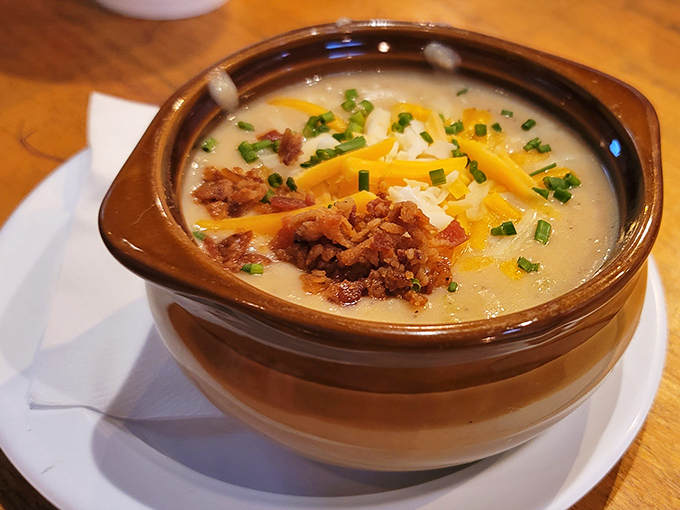 This isn't just soup—it's a warm hug in a bowl. Loaded baked potato goodness topped with cheese, bacon, and green onions for maximum comfort.