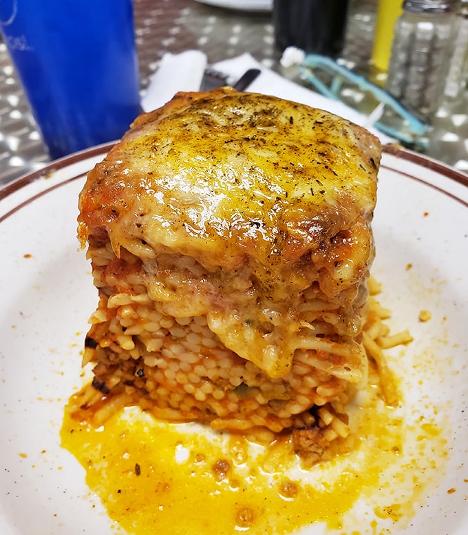 Comfort food engineering at its finest—pasta, sauce, and cheese layered into a gravity-defying tower of homestyle goodness.