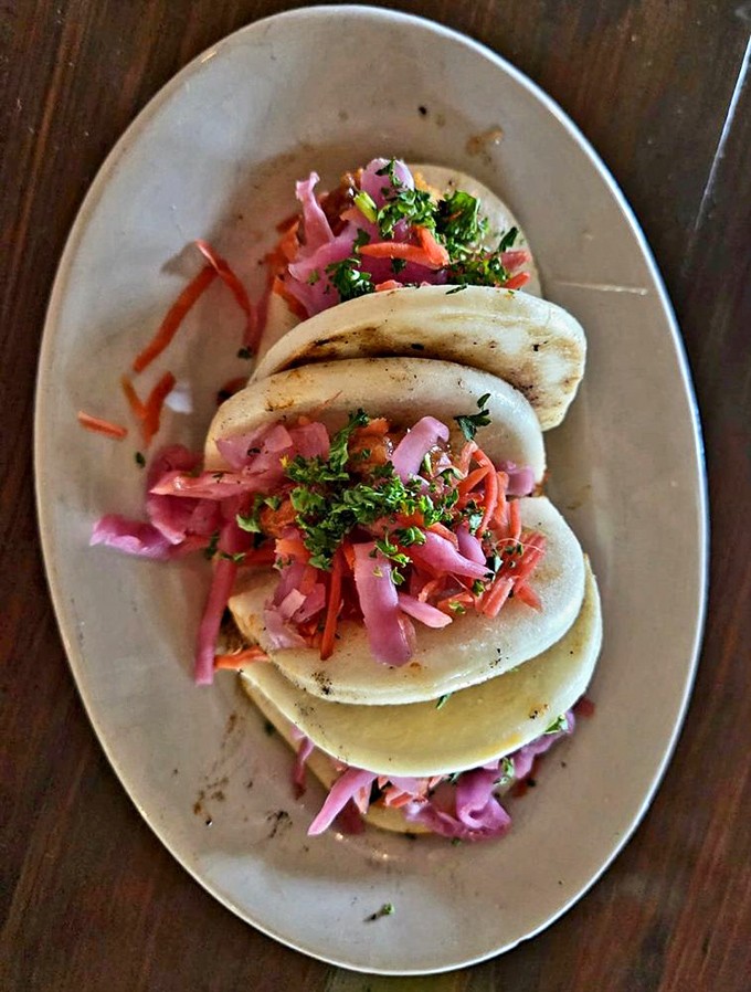 These bao buns aren't just a meal&mdash;they're little pillowy clouds carrying vibrant slaw and spice straight to your happiness center.