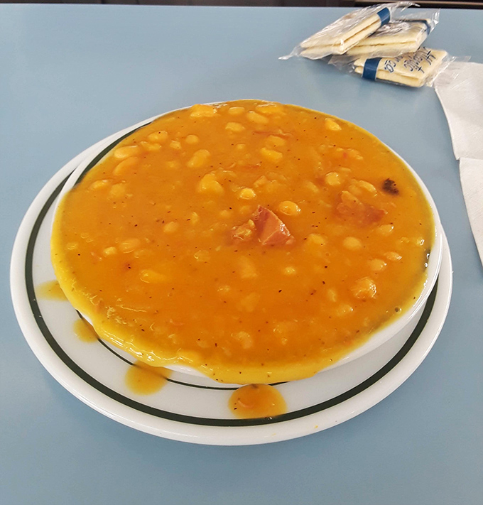 Bean soup that looks like liquid gold, studded with ham nuggets and navy beans. Comfort food that would make your grandmother nod in approval.