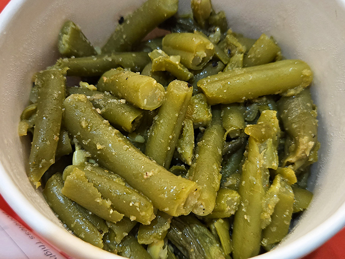 These aren't your cafeteria green beans. Seasoned with soul and cooked with conviction, they're the unsung heroes of the sides menu.