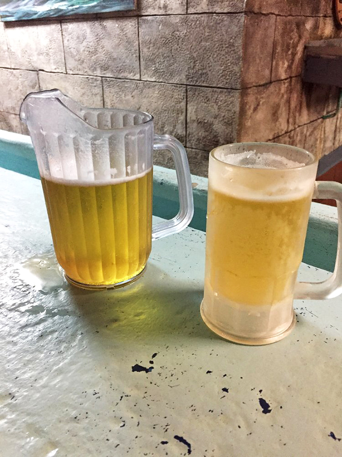 Frosty mugs of beer stand at attention, ready to cool the palate between bites of spicy seafood. The perfect partnership since time immemorial.