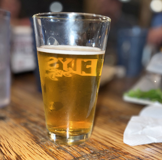 A cold craft beer in a proper glass&mdash;civilization's perfect companion to a gourmet burger and the universal signal for "my weekend starts now."