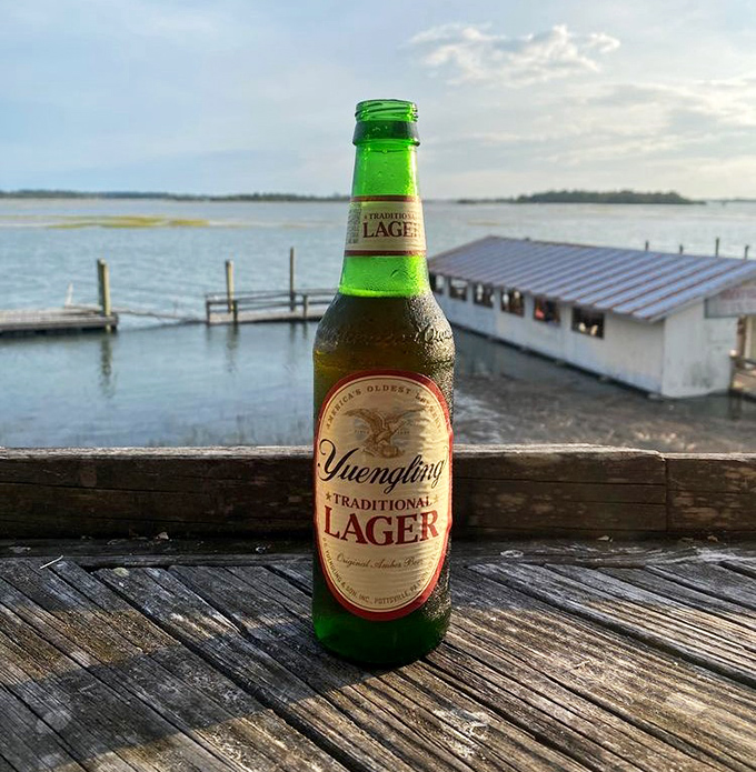 A cold Yuengling with that view? Some moments don't need Instagram filters &ndash; just the simple pleasure of beer, dock, and endless horizon.