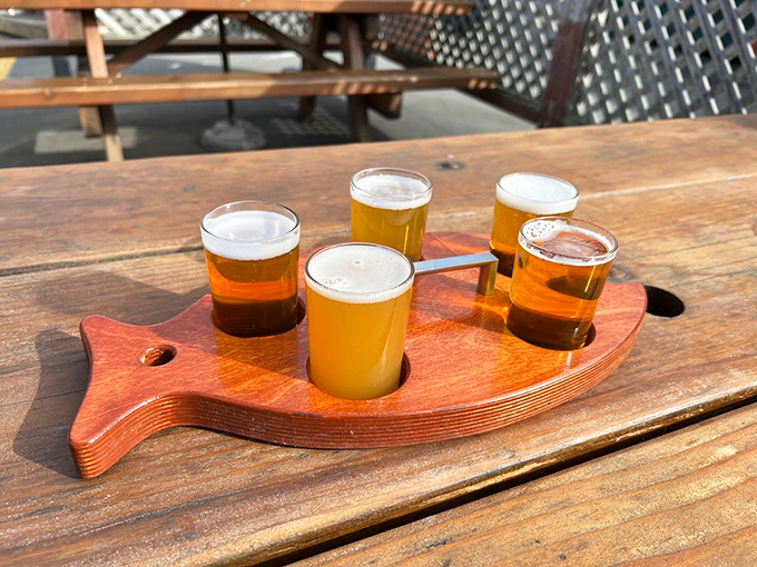 The fish-shaped flight board isn't just cute&mdash;it's practical! Four perfect pours of liquid gold, ready to complement whatever oceanic delight you've chosen.