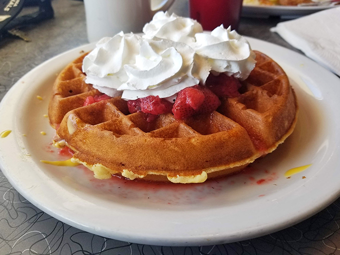 A waffle that doesn't just hold toppings&mdash;it showcases them like a Broadway stage, with whipped cream and berries stealing the spotlight.