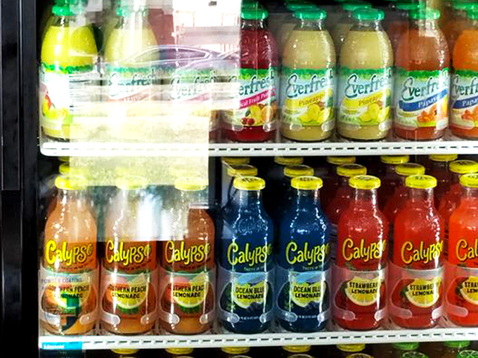The beverage case offers a rainbow of thirst-quenching options. In the chicken universe, these colorful drinks are the perfect supporting cast.