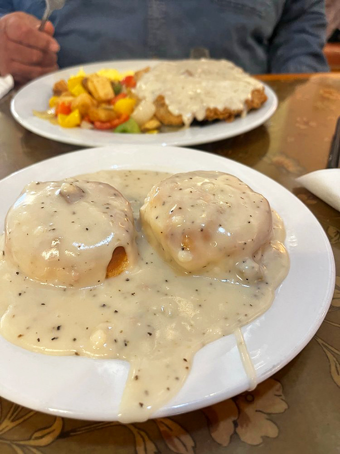 Biscuits drowning in creamy sausage gravy &ndash; a breakfast that says "go back to bed after this." Worth every delicious calorie.