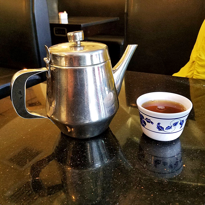 The classic silver teapot and blue-patterned cup &ndash; a timeless intermission between acts in this all-you-can-eat theater.